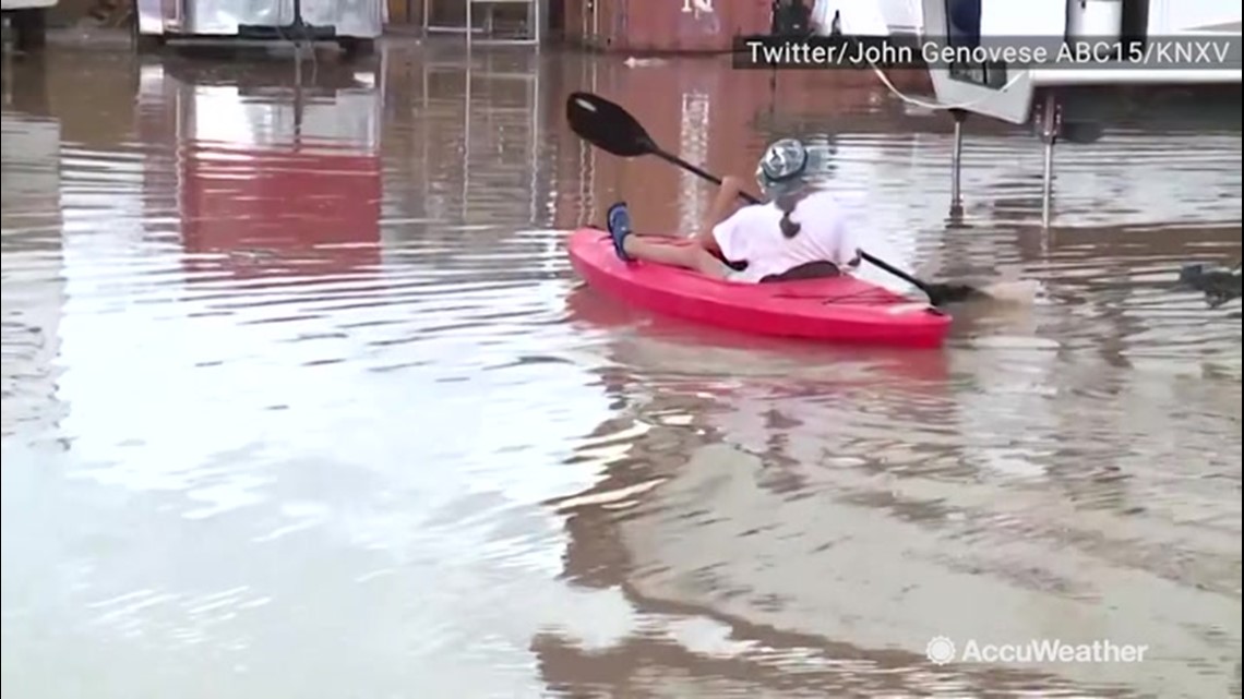 Man kayaks through flooded roads | newswest9.com