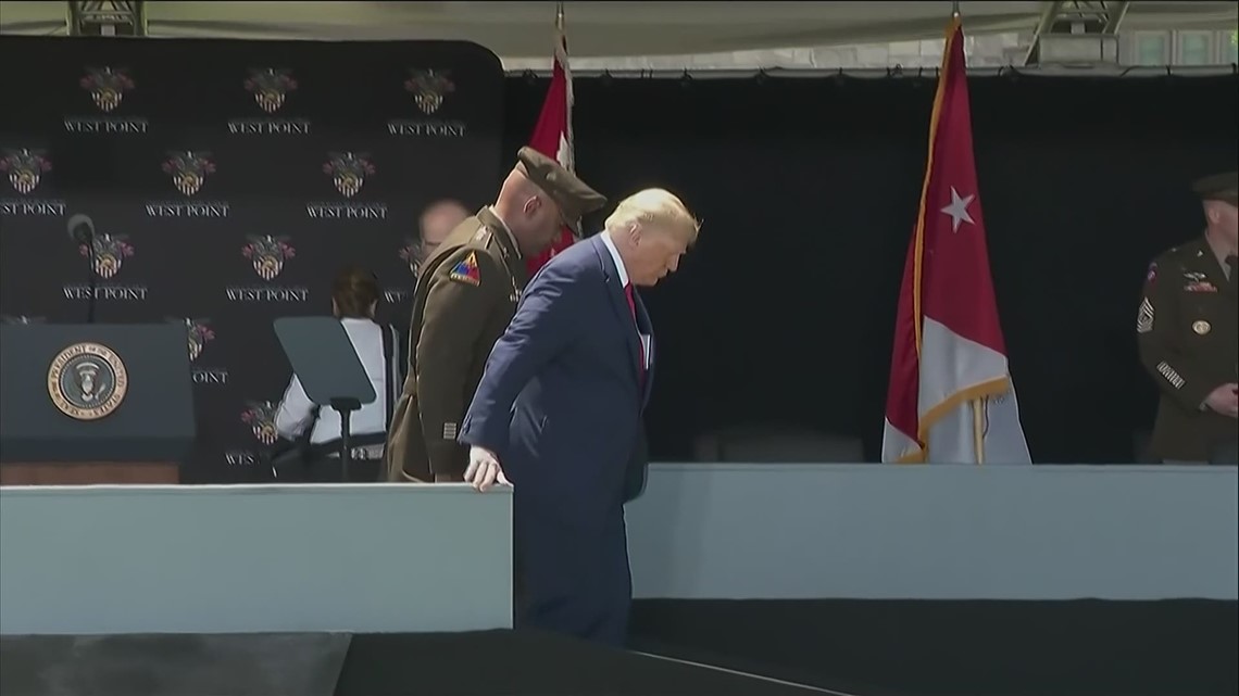 Trump appears to steady himself walking down West Point ramp ...
