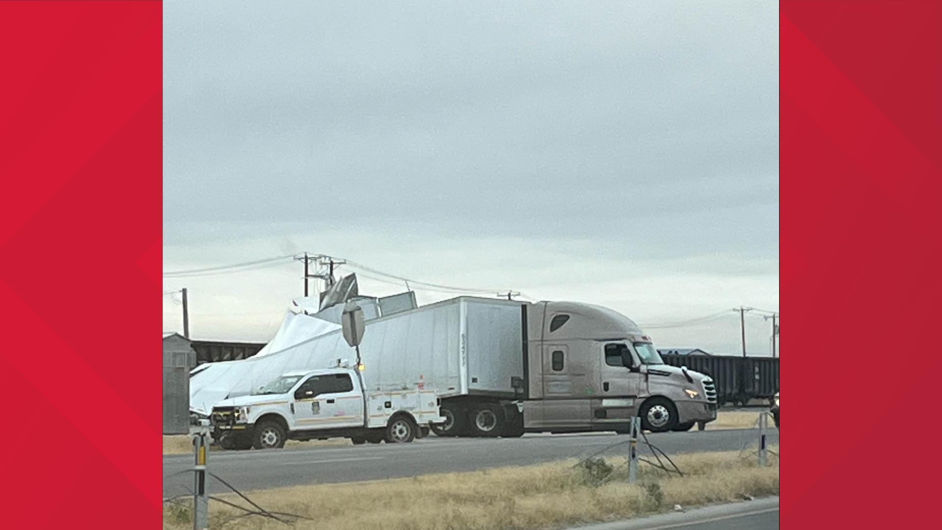 Semi-truck hit by train on County Road 1250 in Midland | newswest9.com
